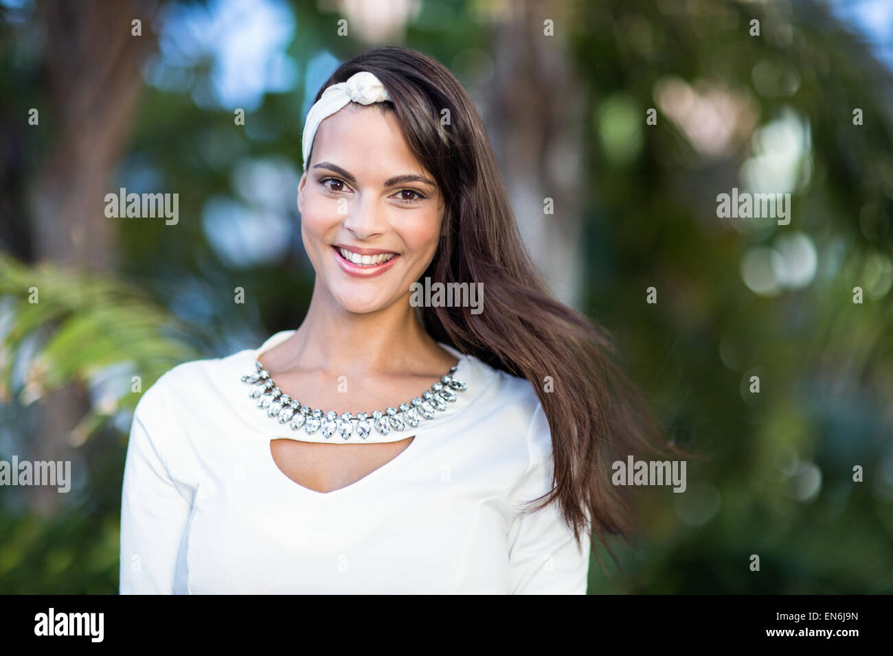 Beautiful woman smiling at camera Stock Photo - Alamy