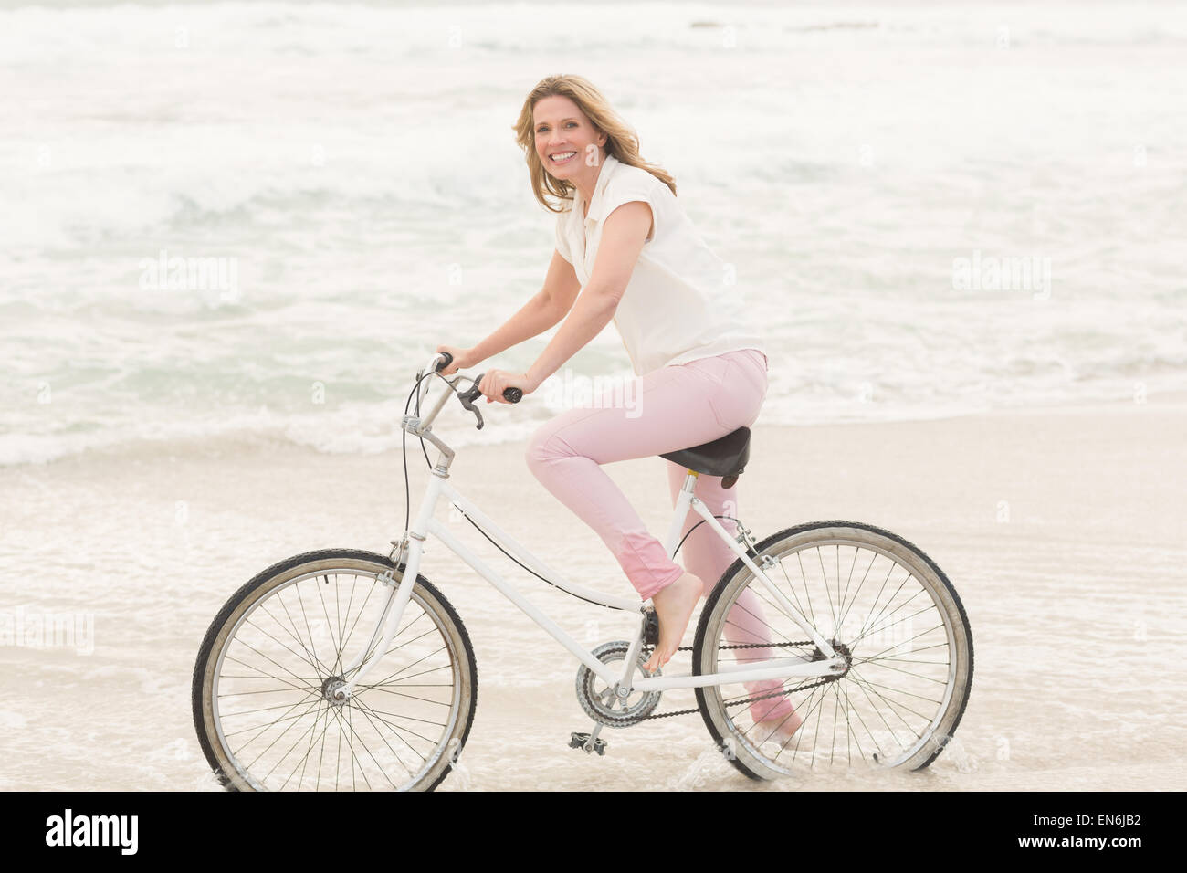 Casual woman on bike hi-res stock photography and images - Alamy