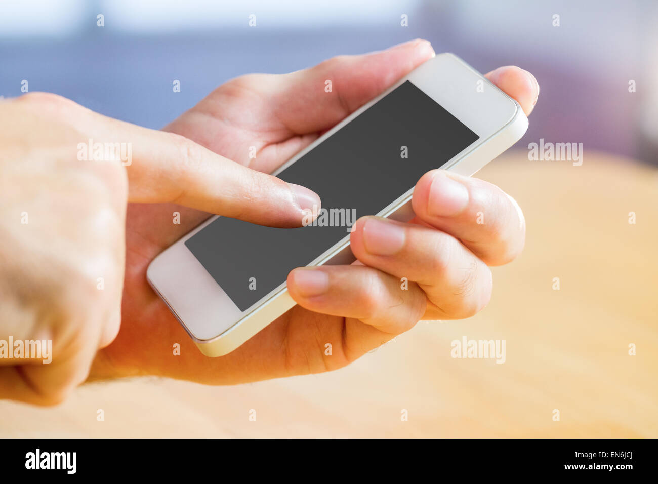 Hand holding a white smartphone Stock Photo - Alamy