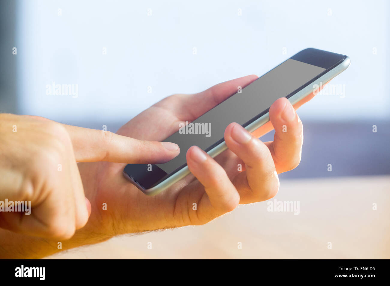 Hand holding a black smartphone Stock Photo - Alamy