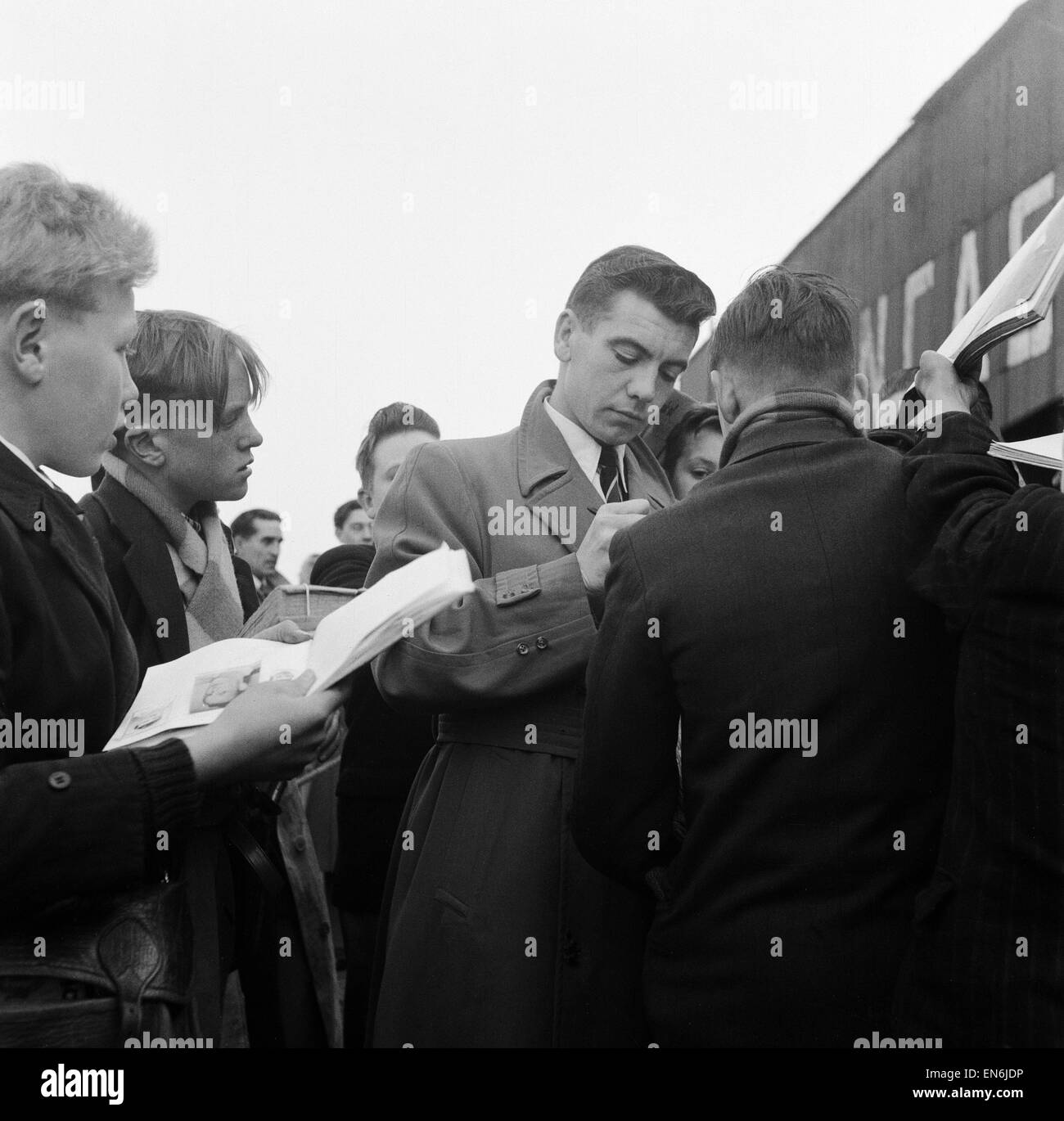 Johnny Haynes of Fulham signing autographs. 31st October 1955 Stock ...