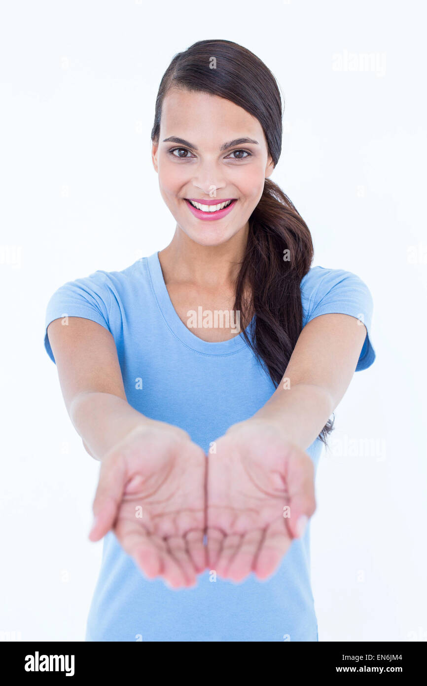 Happy woman presenting her hands Stock Photo - Alamy