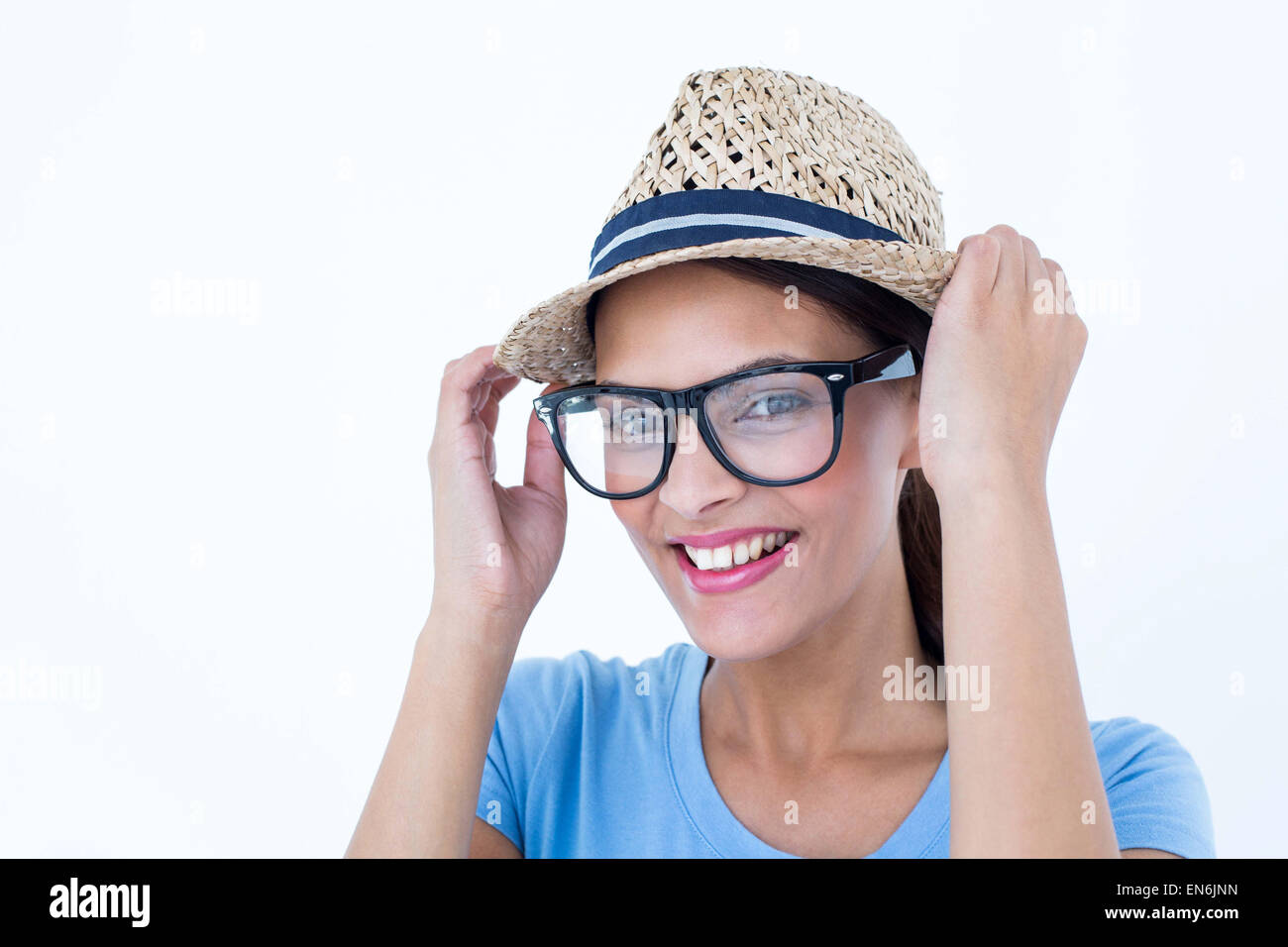 Woman standing holding hat hi-res stock photography and images - Alamy