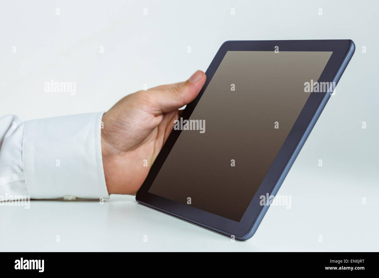 Man using a tablet pc Stock Photo - Alamy