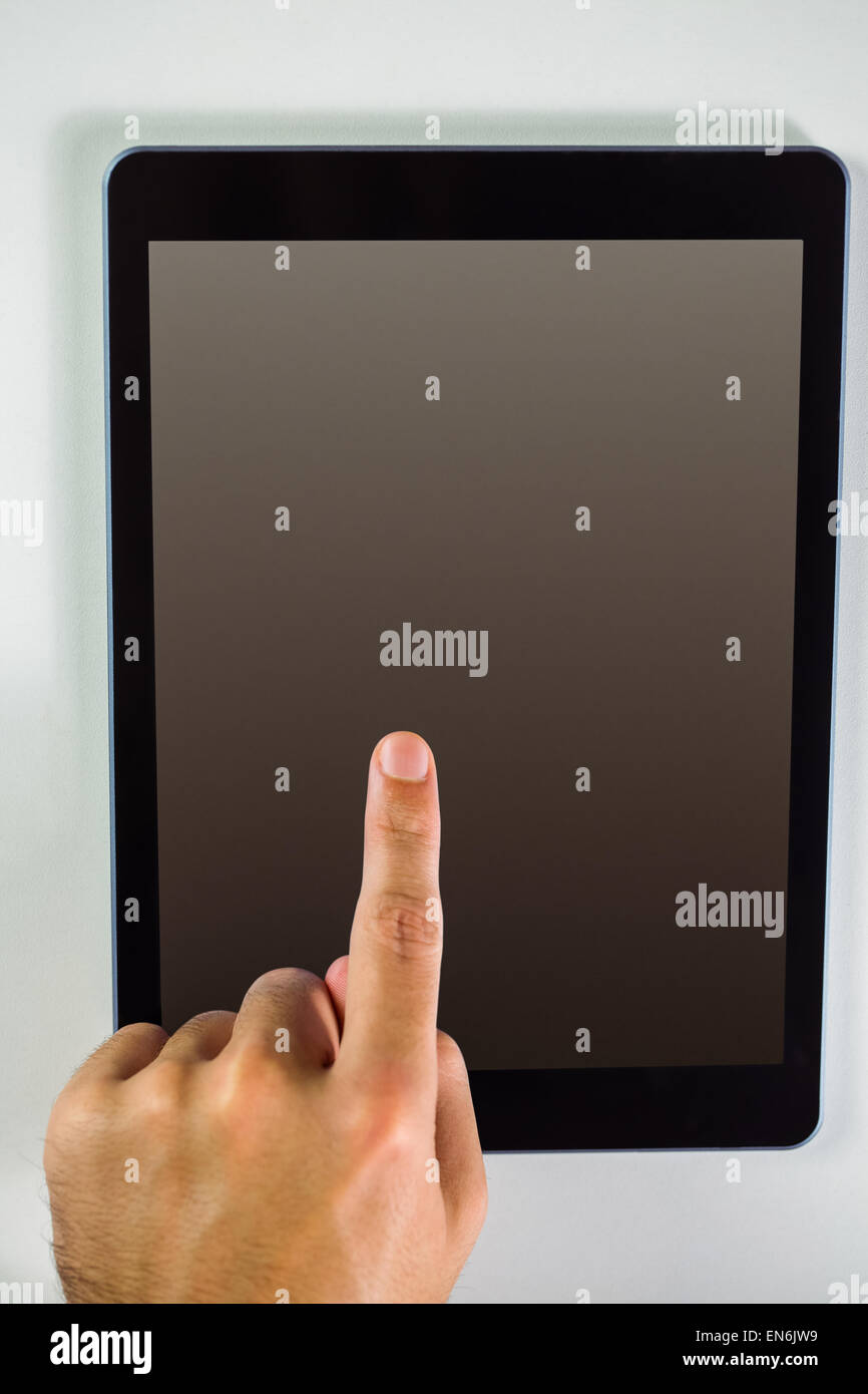 Man using his tablet pc Stock Photo - Alamy