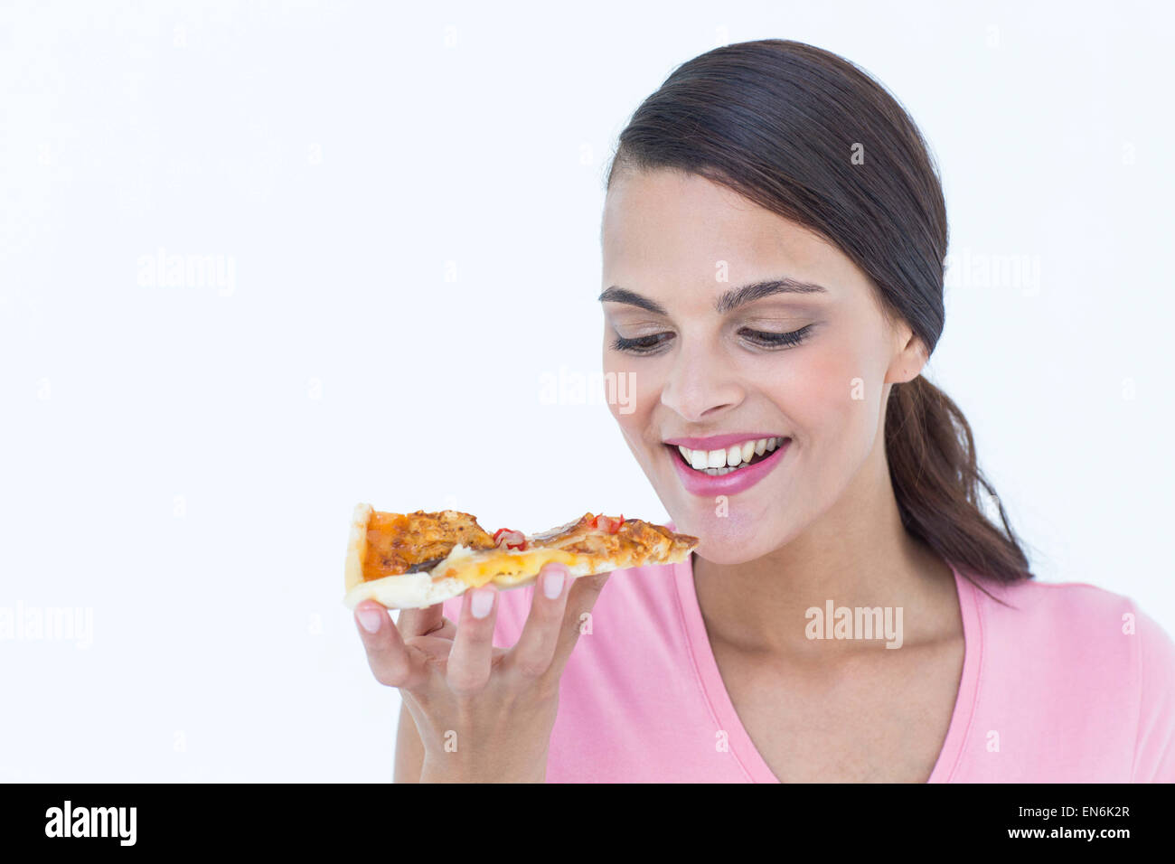 Beautiful woman eating a pizza Stock Photo - Alamy