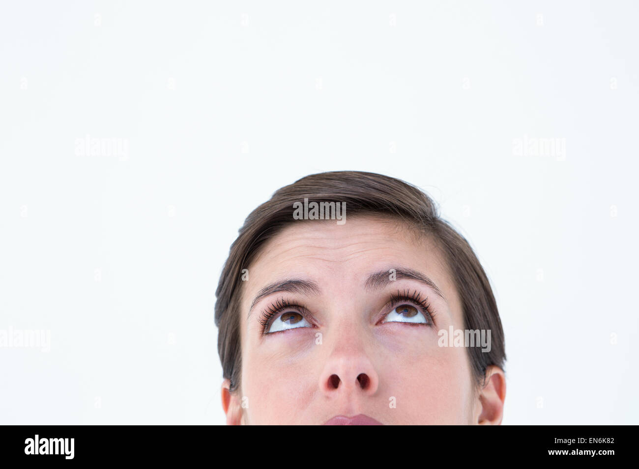 Beautiful brunette looking up Stock Photo - Alamy