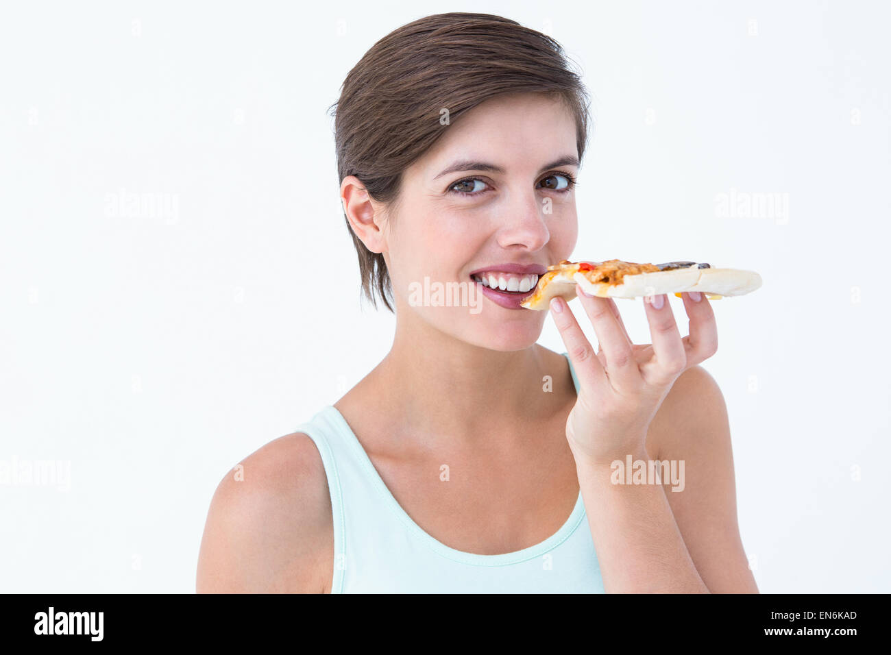 Beautiful woman eating a pizza Stock Photo - Alamy