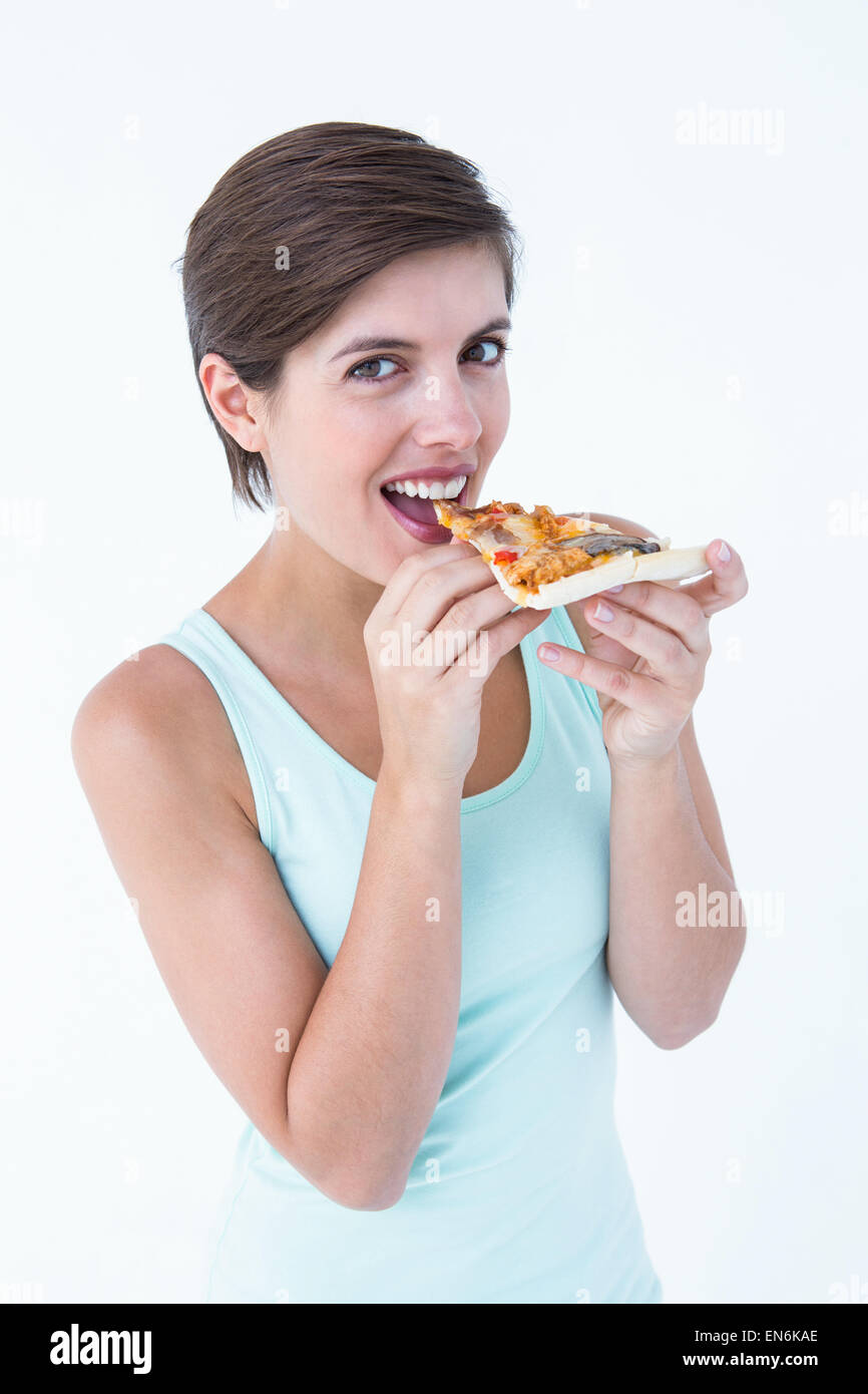 Beautiful woman eating a pizza Stock Photo - Alamy