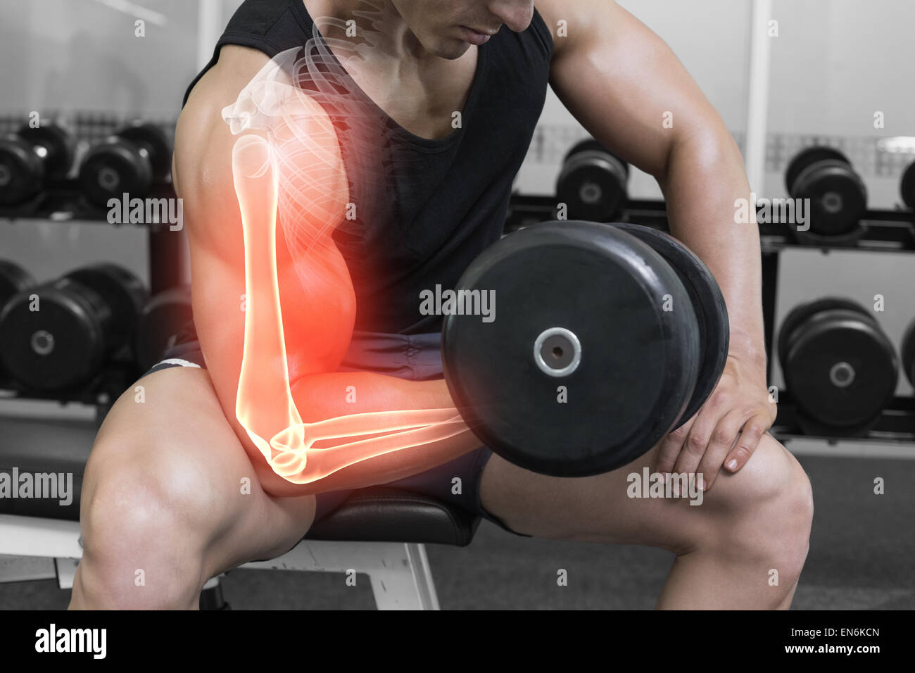 Highlighted arm of strong man lifting weights Stock Photo - Alamy