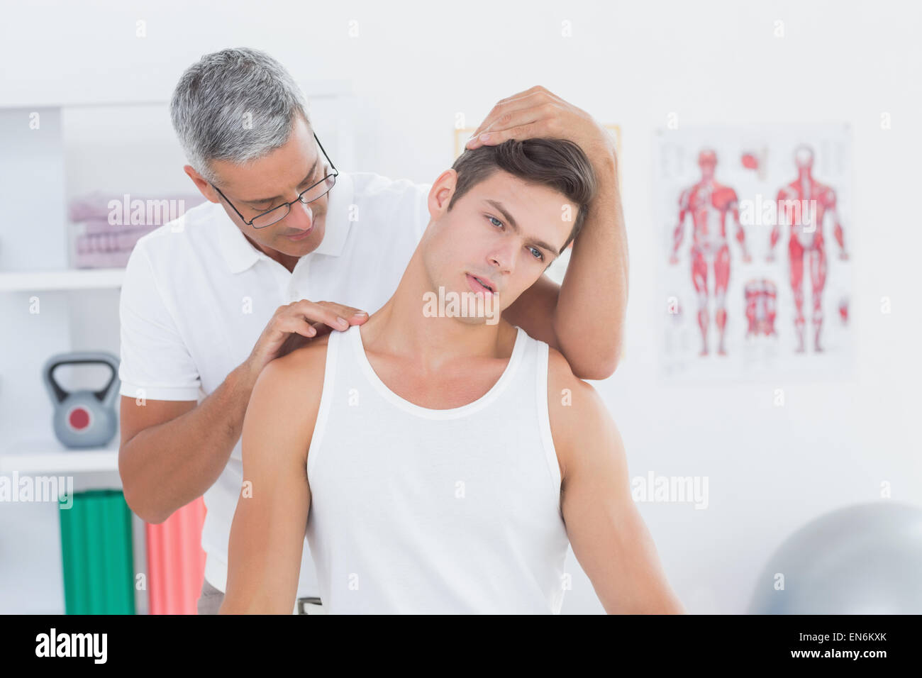 Doctor doing neck adjustment Stock Photo - Alamy