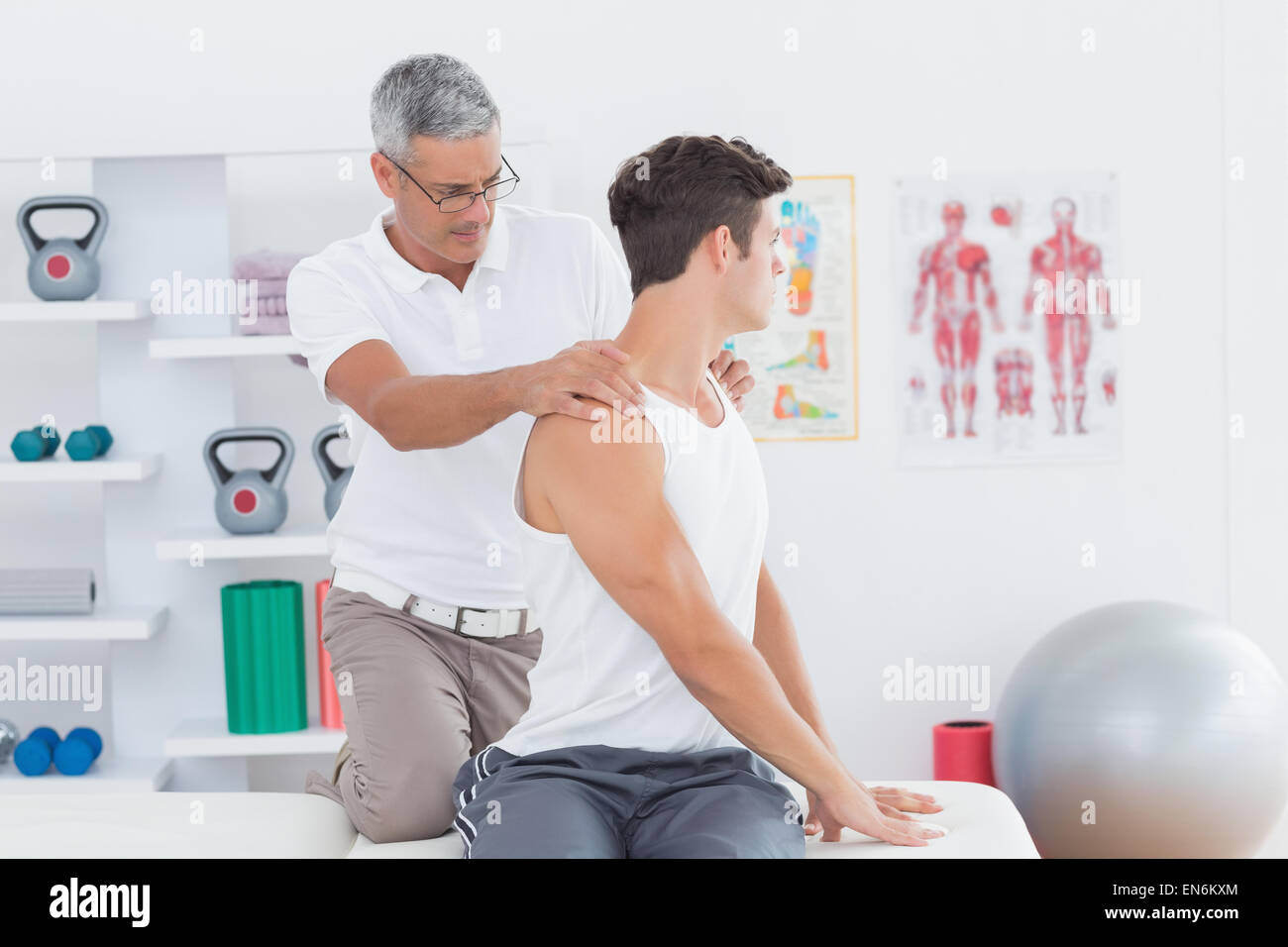 Doctor doing back adjustment Stock Photo - Alamy