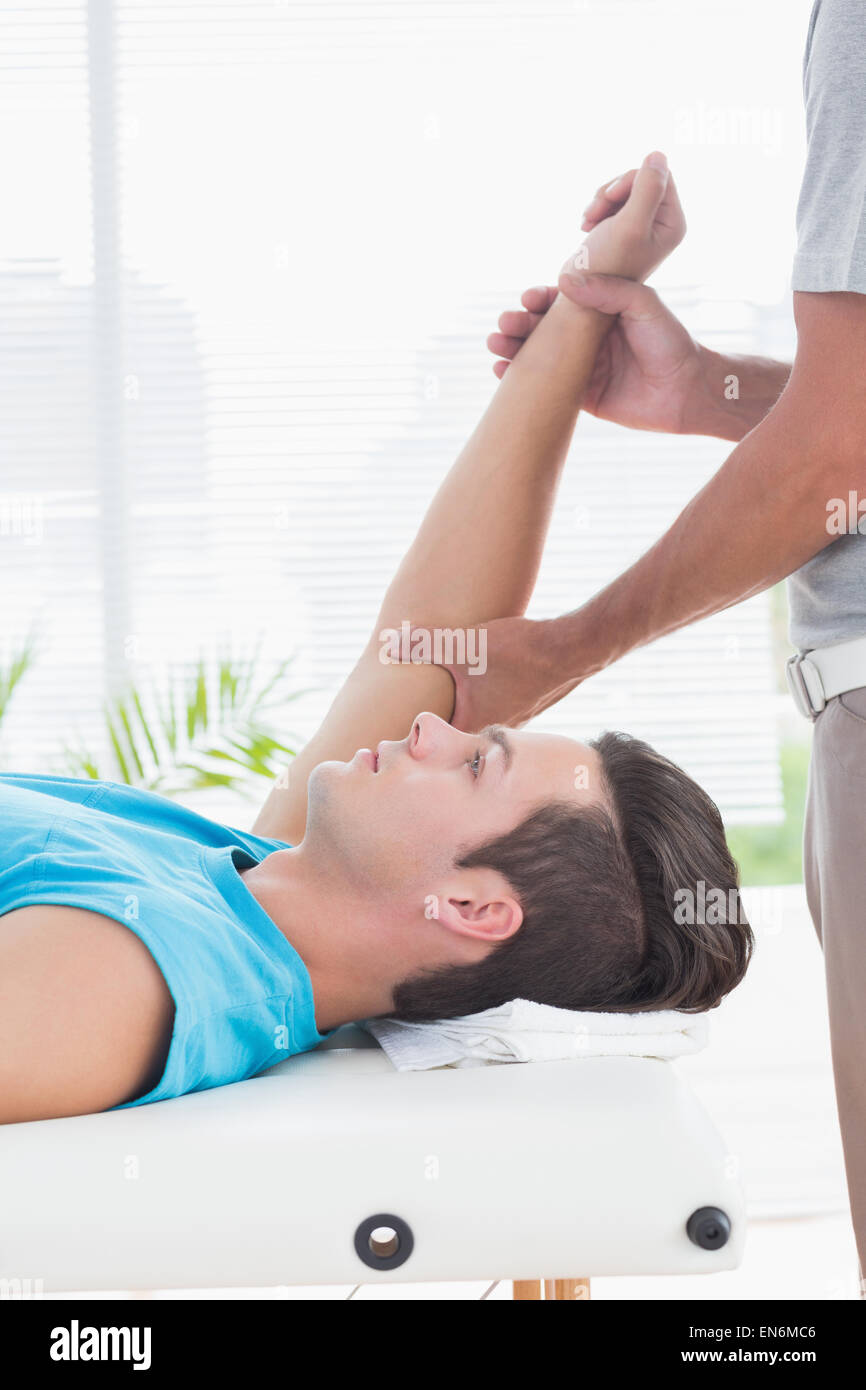 Doctor examining his patient arm Stock Photo - Alamy