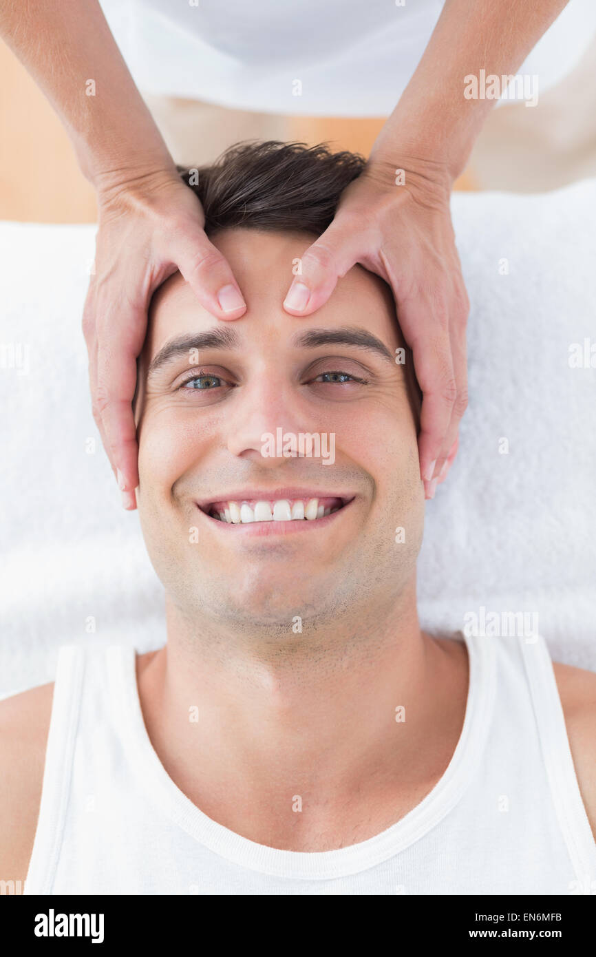 Smiling man receiving head massage Stock Photo - Alamy