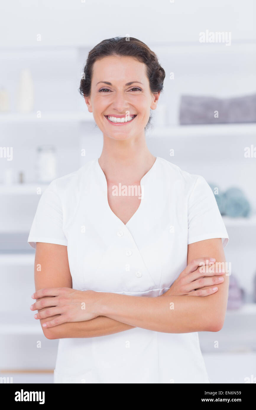 Smiling doctor looking camera arms hi-res stock photography and images - Alamy