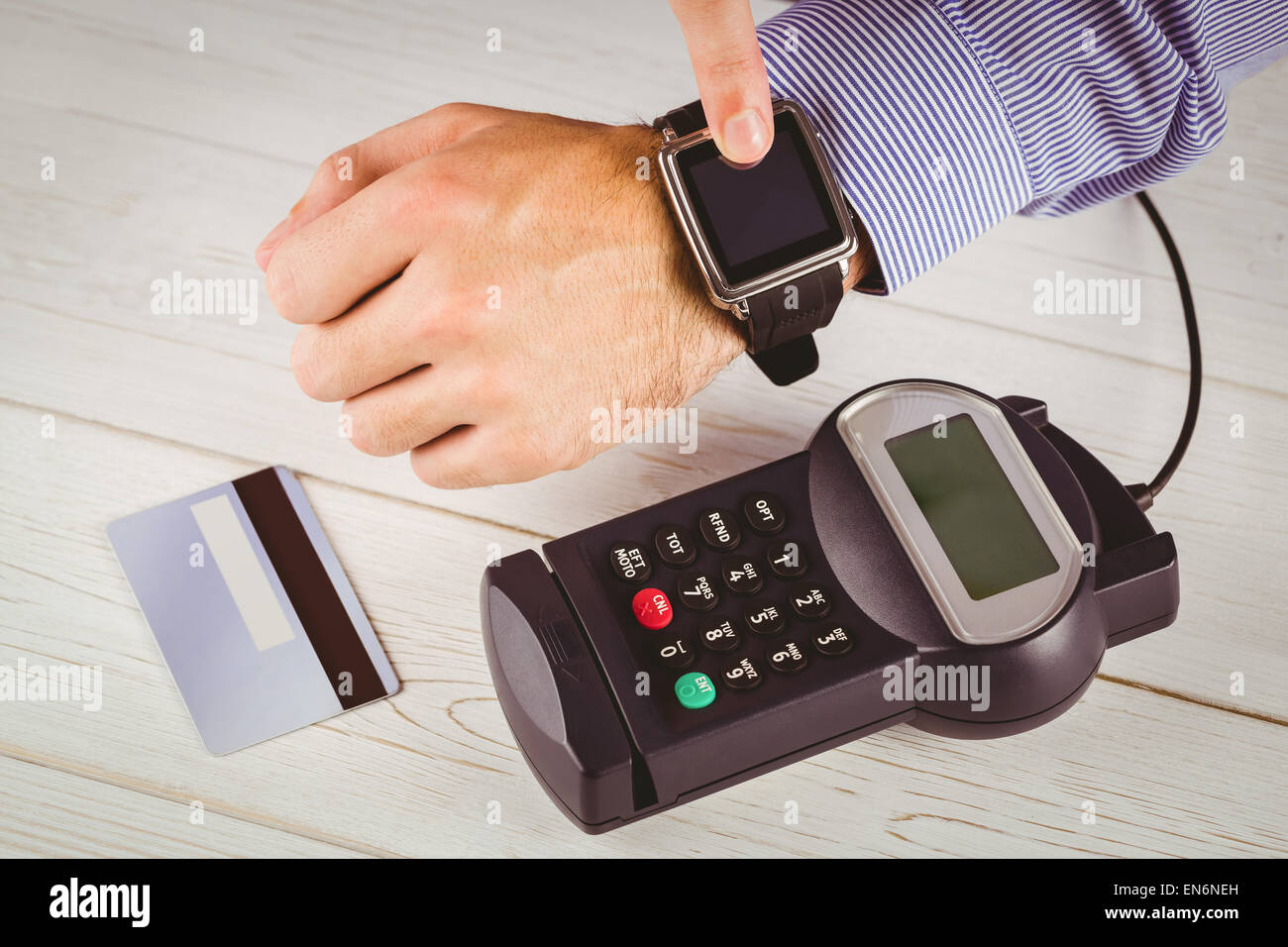Man using smart watch to express pay Stock Photo - Alamy