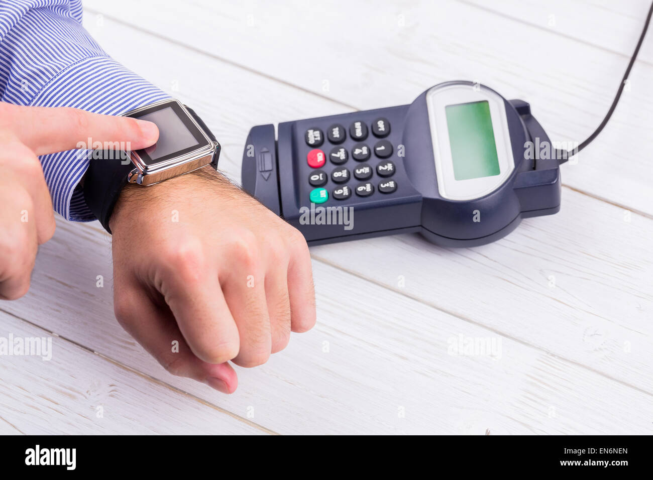 Pay with watch hi-res stock photography and images - Alamy