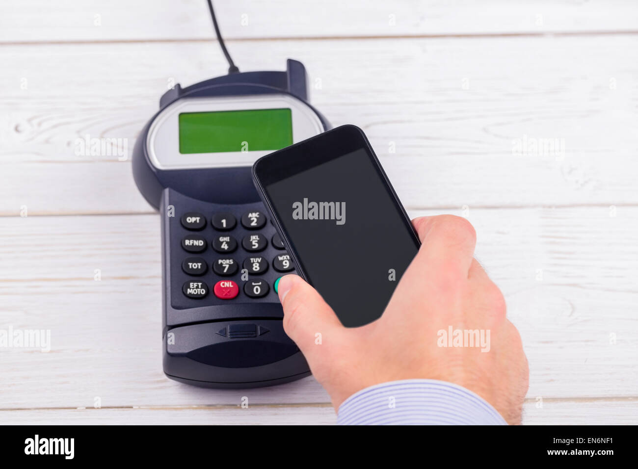 Man using smartphone to express pay Stock Photo - Alamy