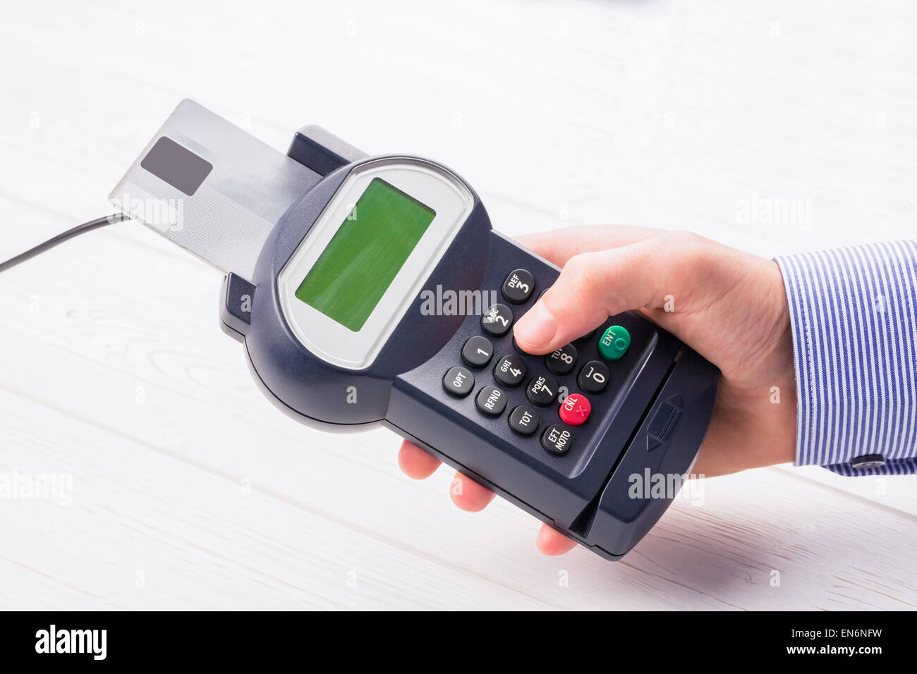 Man entering his pin on terminal Stock Photo - Alamy