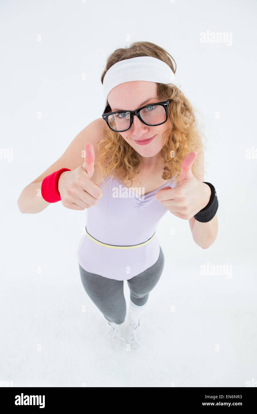 Geeky hipster posing with thumbs up Stock Photo - Alamy