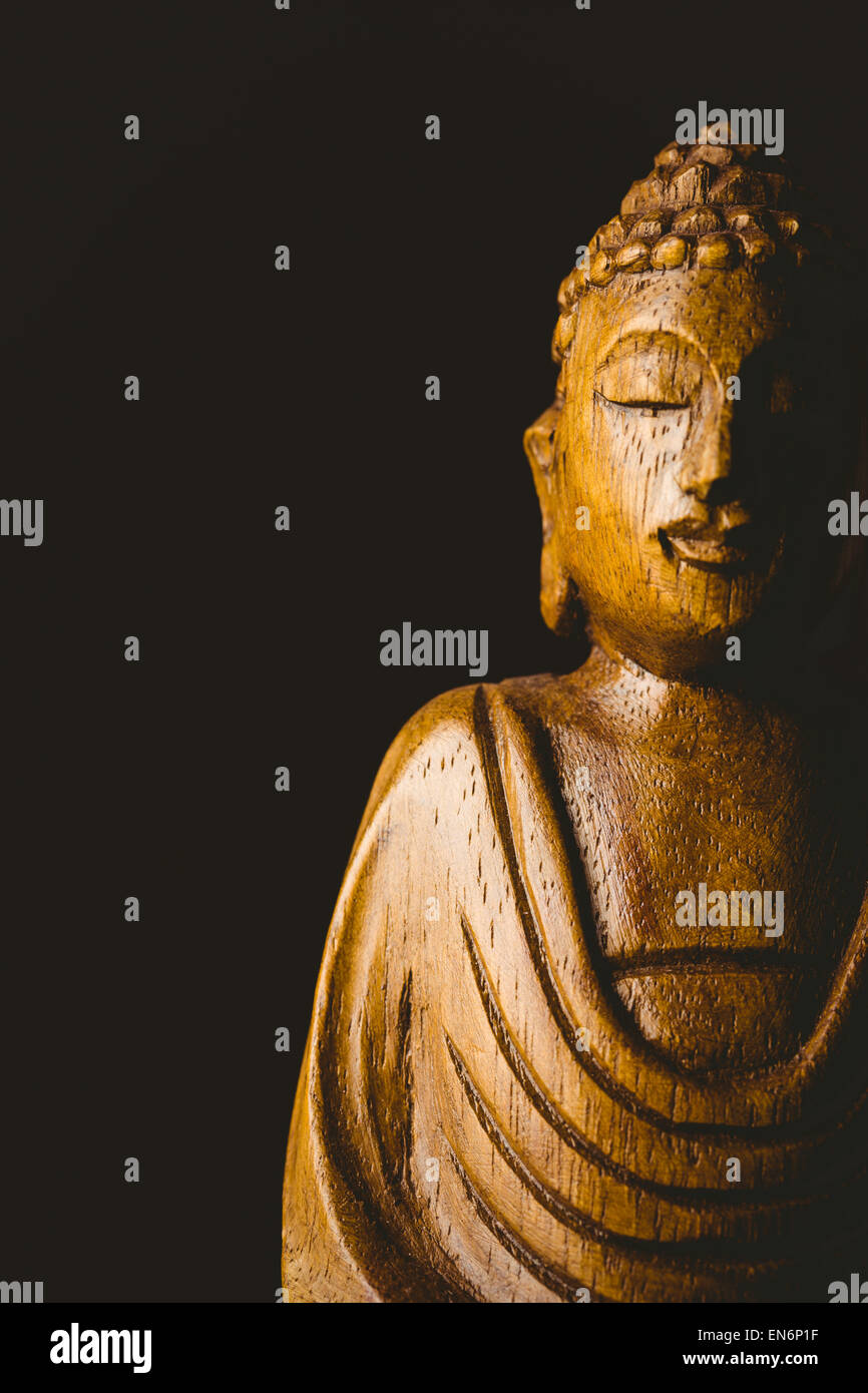Wooden buddha statue Stock Photo - Alamy