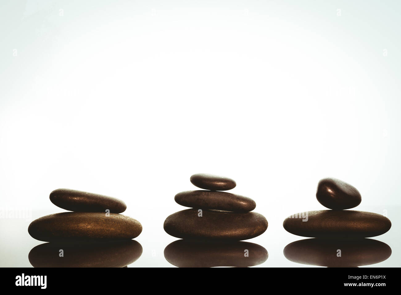 Zen stones balancing on white background Stock Photo - Alamy