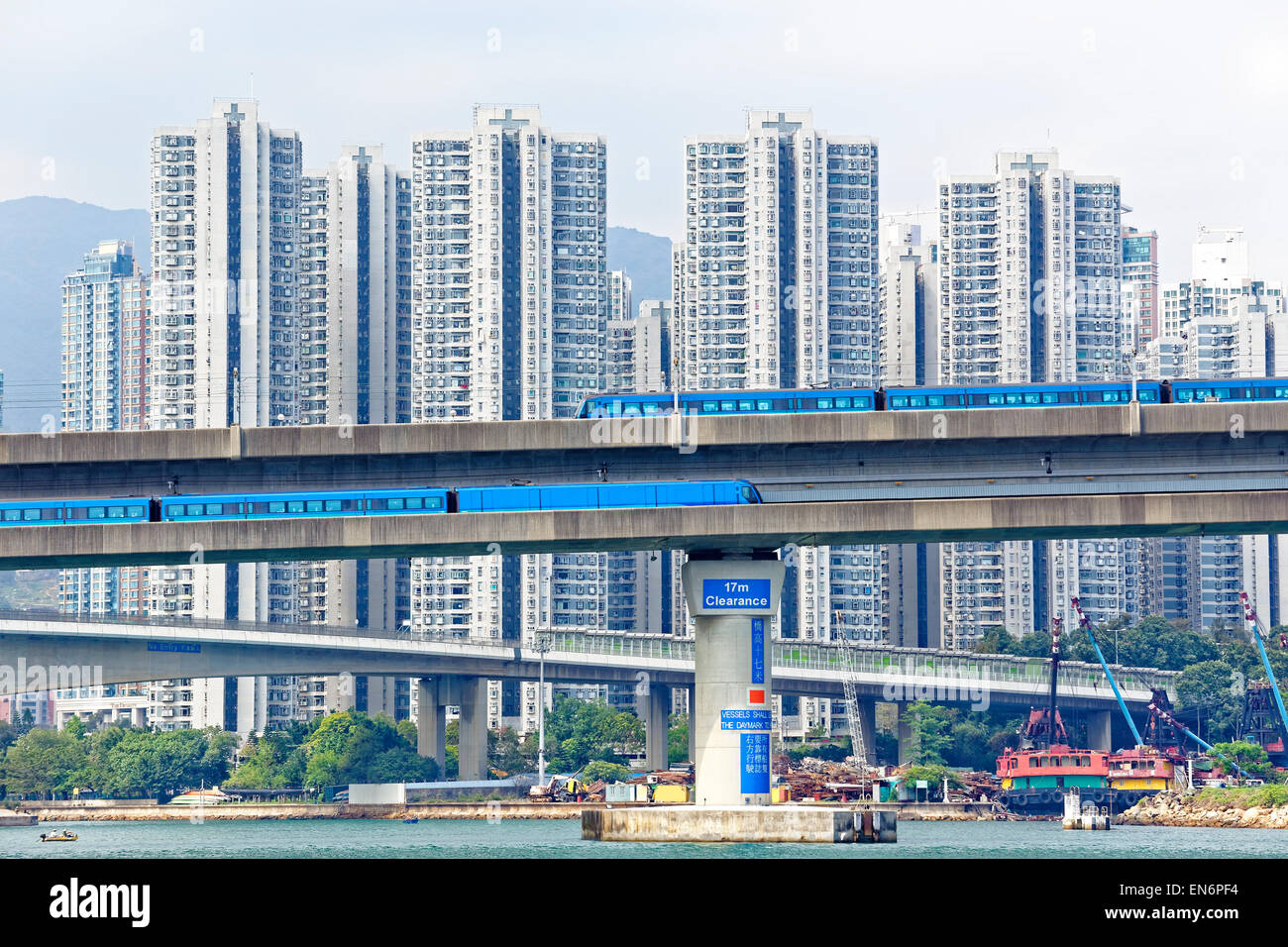 high speed train on bridge in hong kong downtown city at day Stock ...