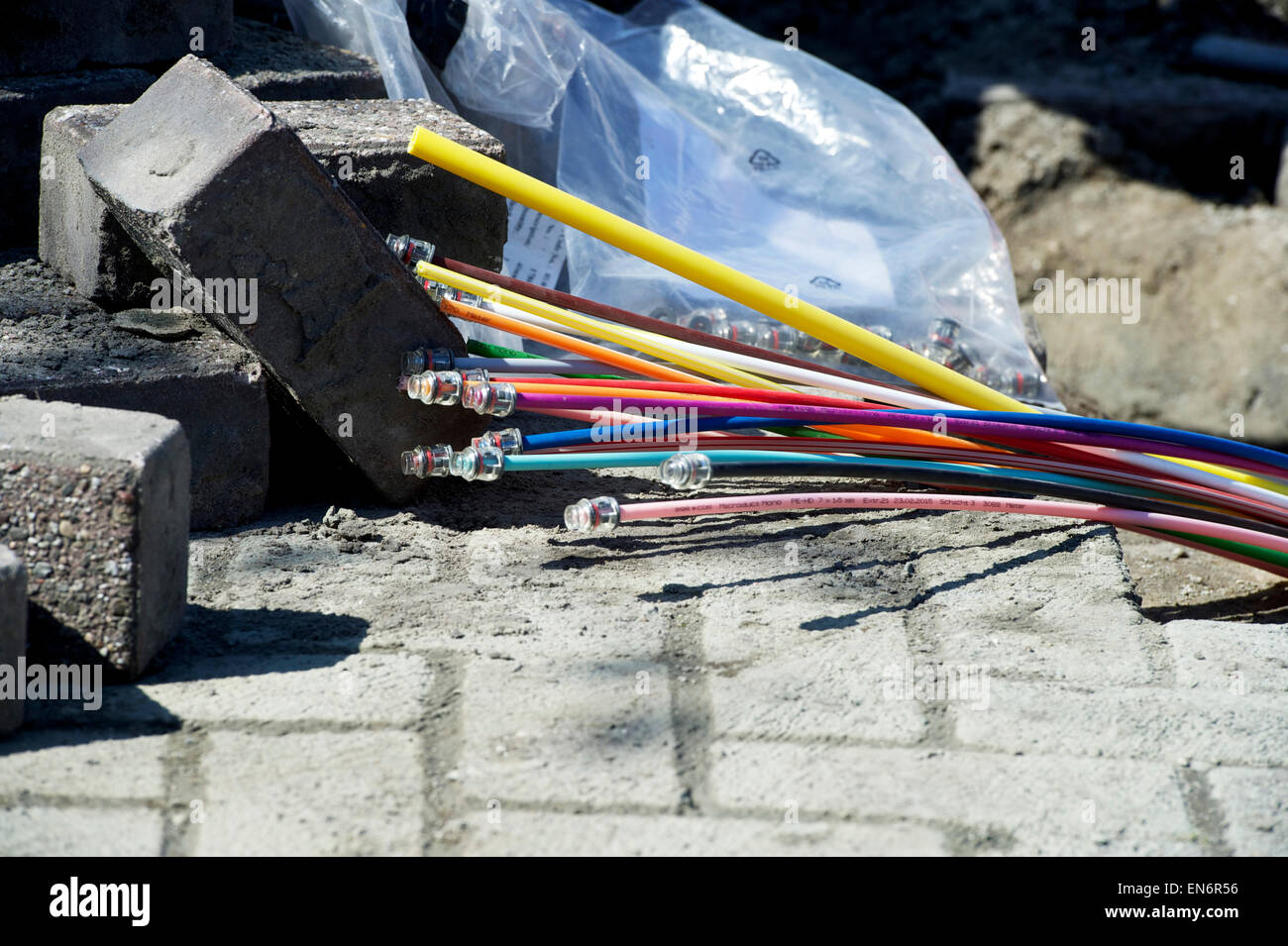 Men laying optical fiber cables Stock Photo - Alamy