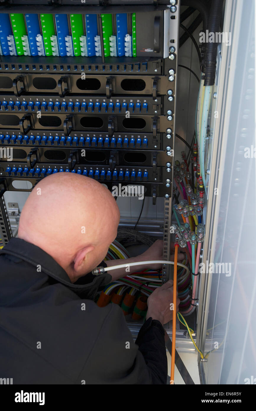 Men laying optical fiber cables Stock Photo - Alamy