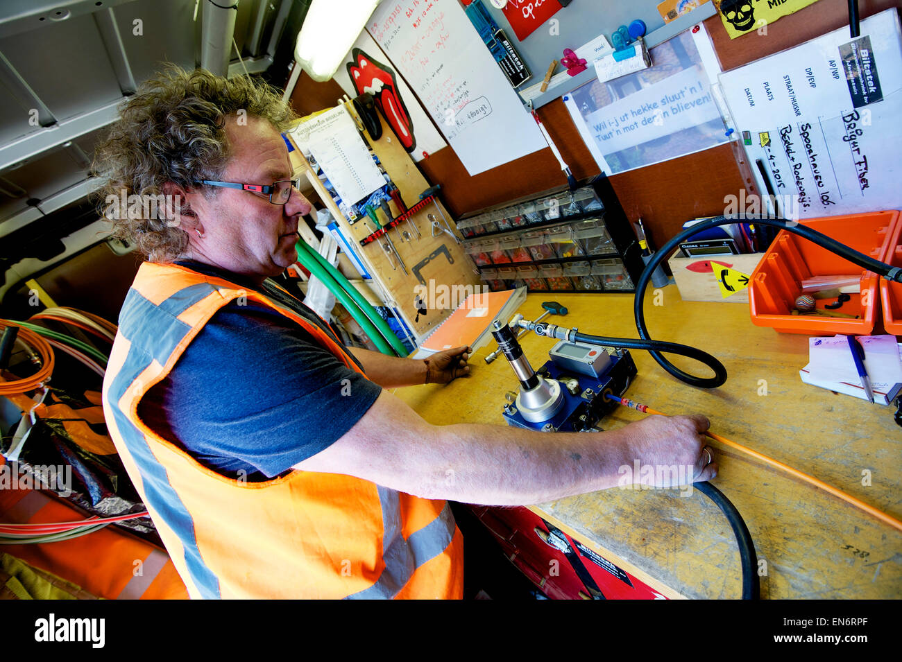 Men laying optical fiber cables Stock Photo - Alamy