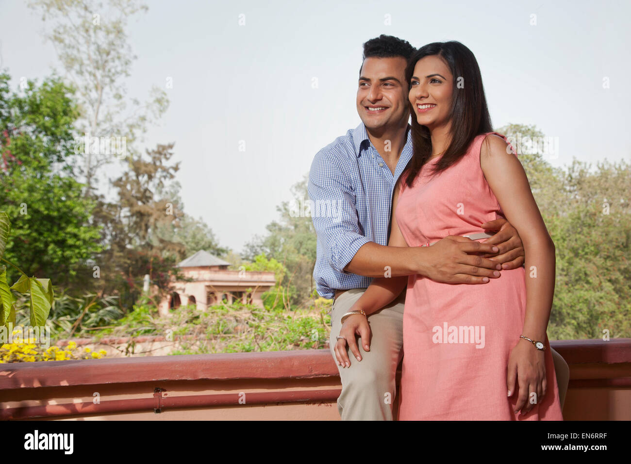 Couple standing together Stock Photo - Alamy