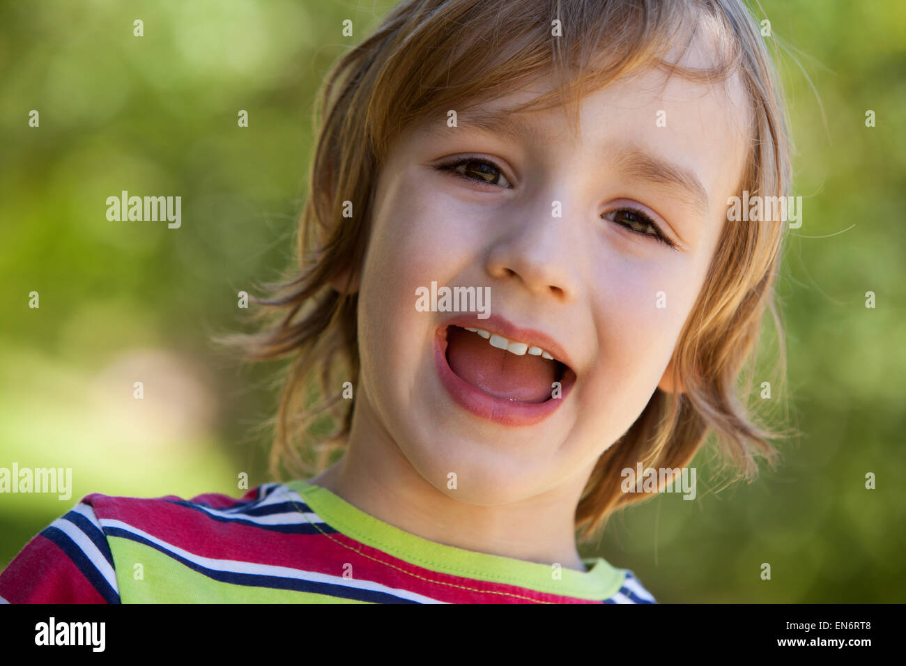Happy little boy in the park Stock Photo - Alamy