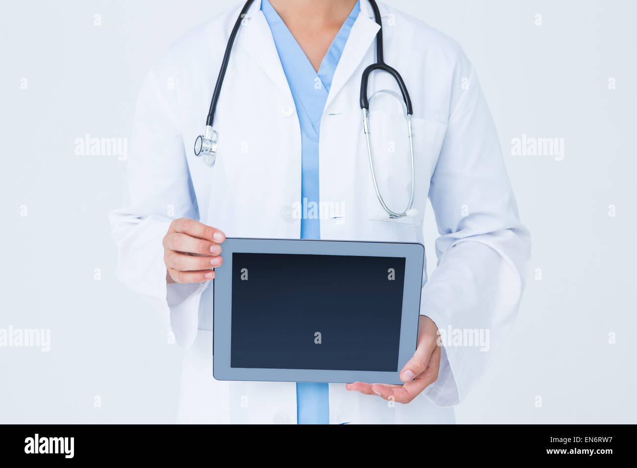 Doctor showing tablet pc Stock Photo - Alamy