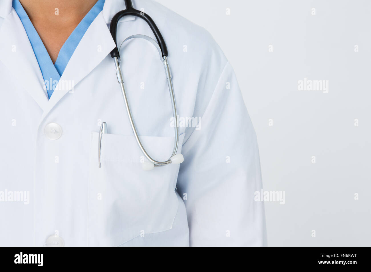 Doctor standing with stethoscope Stock Photo - Alamy