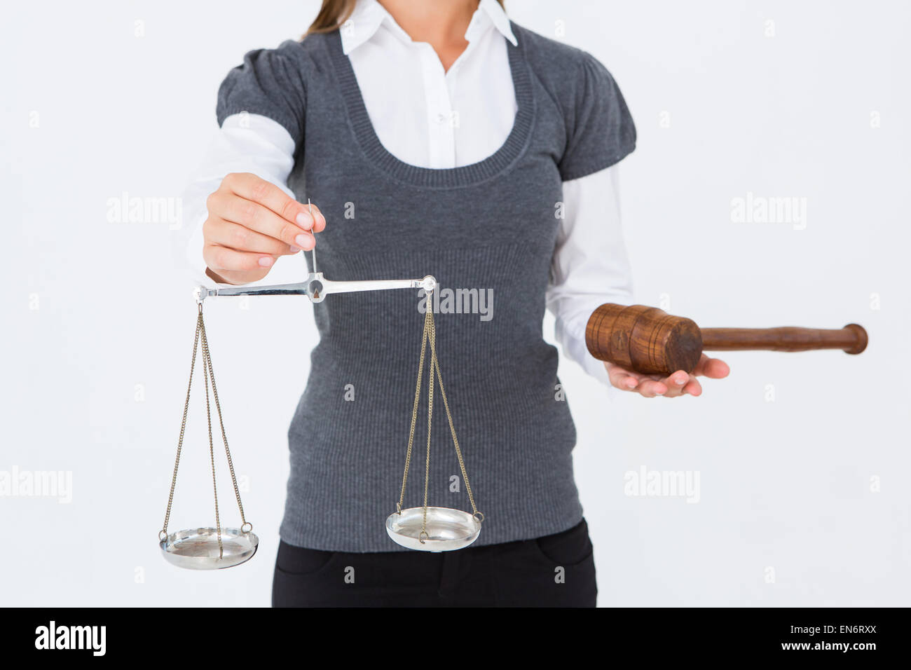 Woman holding a gavel and scales of justice Stock Photo - Alamy