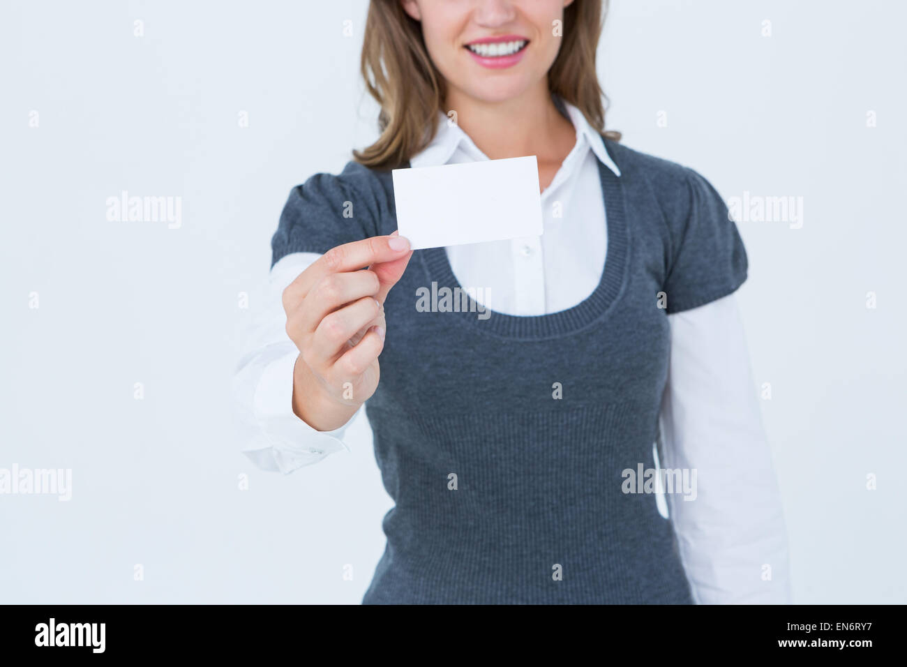 Smiling woman showing card Stock Photo - Alamy