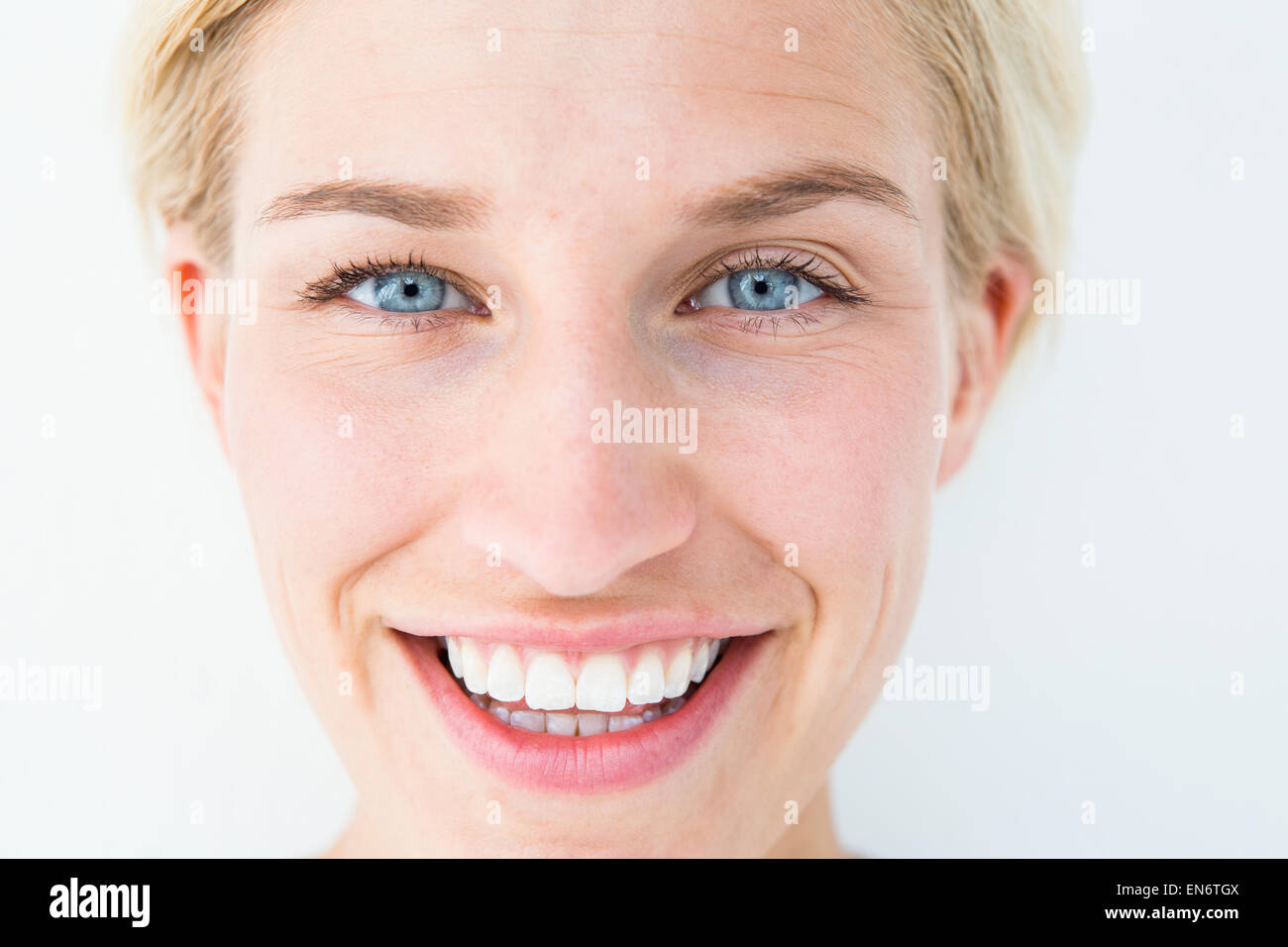 Happy blonde smiling at camera Stock Photo - Alamy