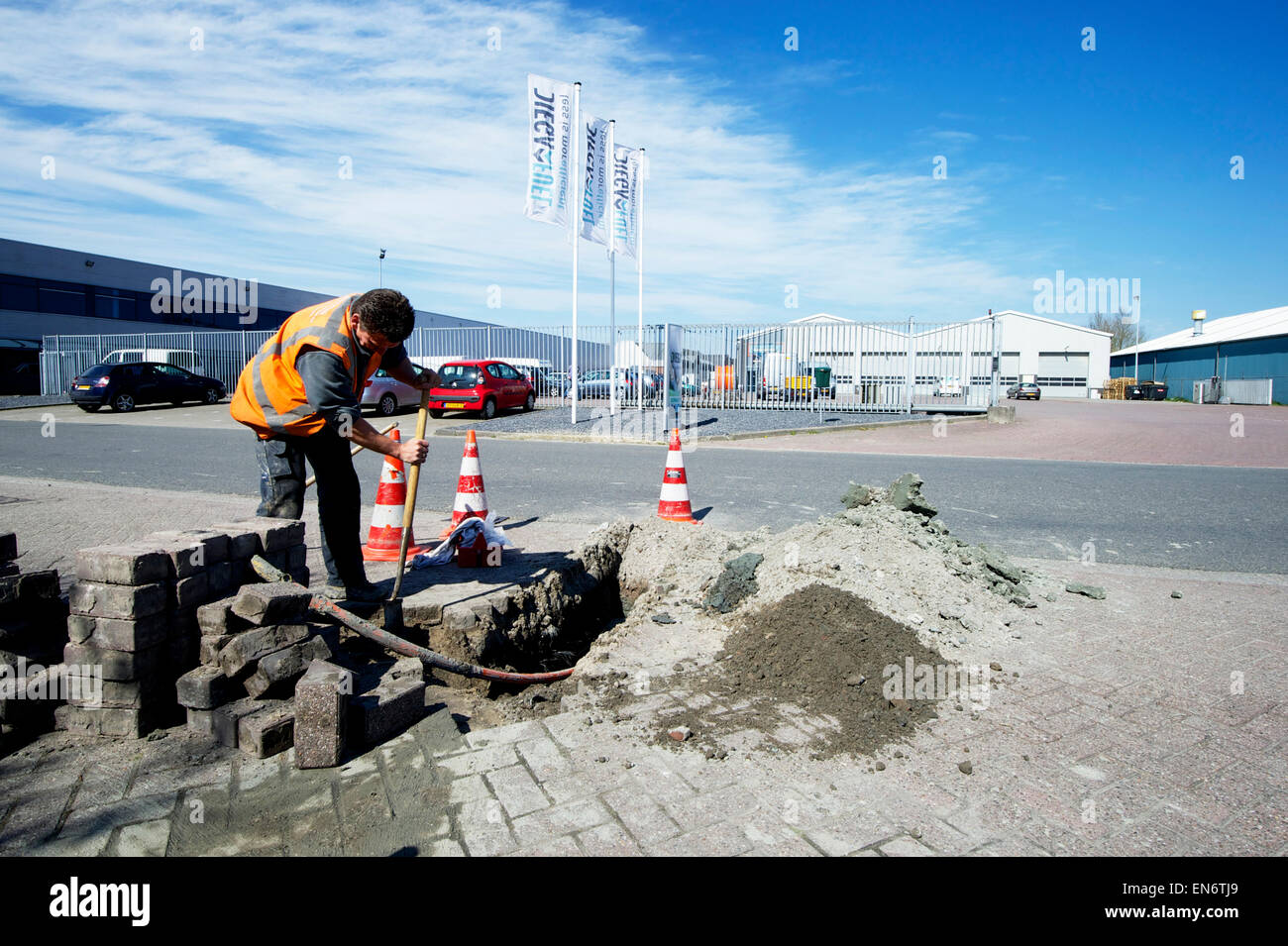 Men laying optical fiber cables Stock Photo - Alamy