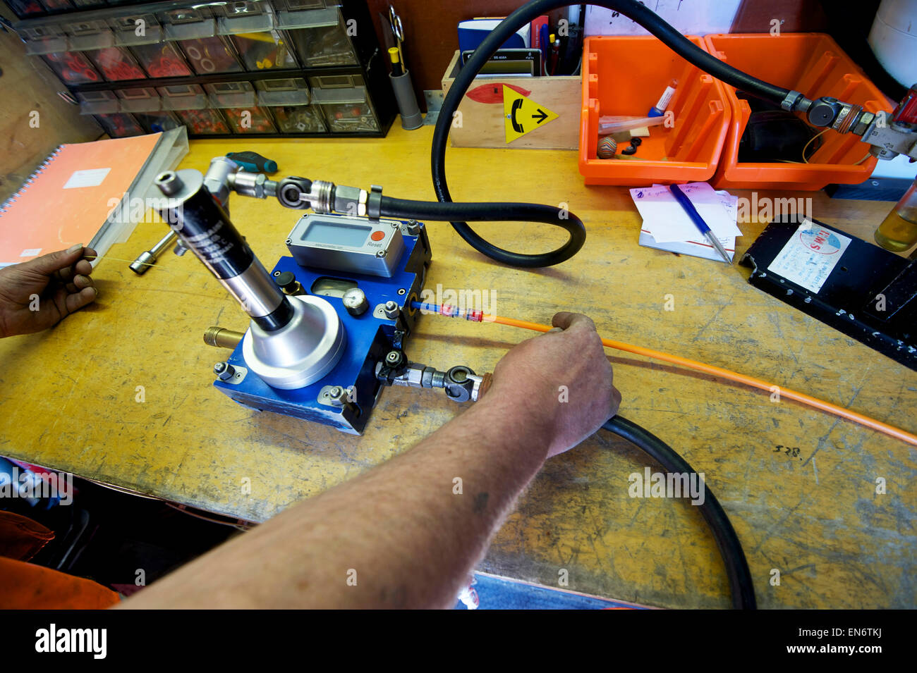 Men laying optical fiber cables Stock Photo - Alamy
