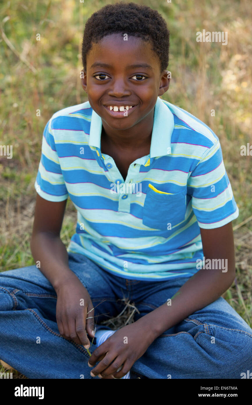 Cute little boy smiling at camera Stock Photo - Alamy