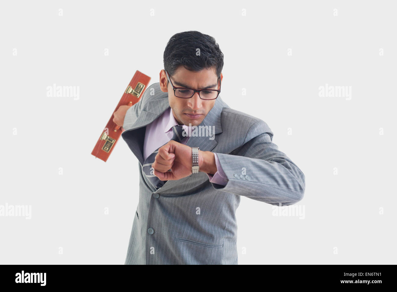 Businessman getting late for work Stock Photo - Alamy