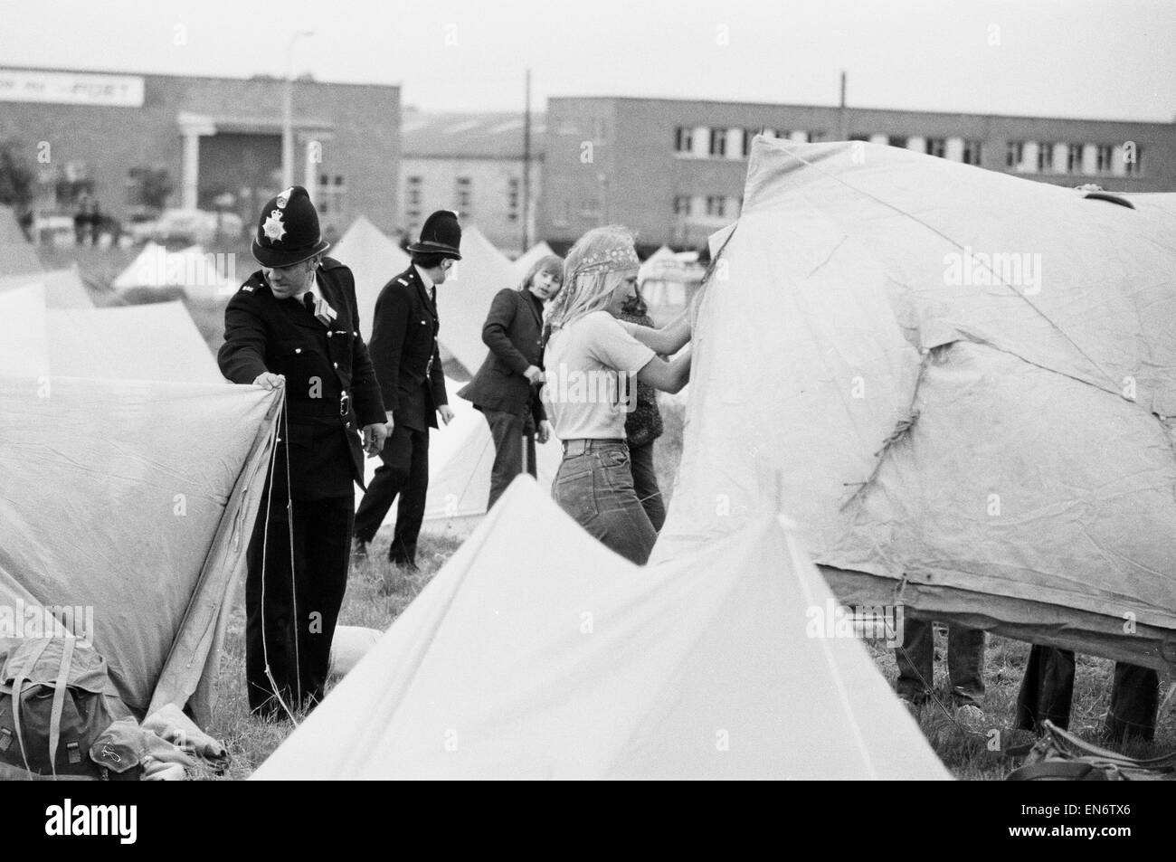 Reading Pop Festival. Uniformed police officers help camping pop fans ...