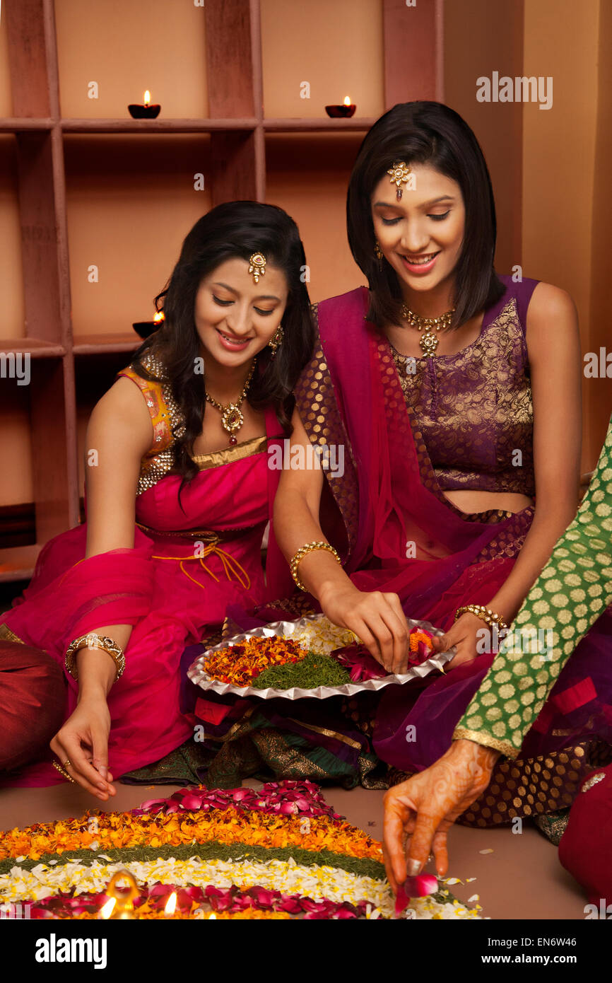 Indian Women Making Rangoli High Resolution Stock Photography and ...
