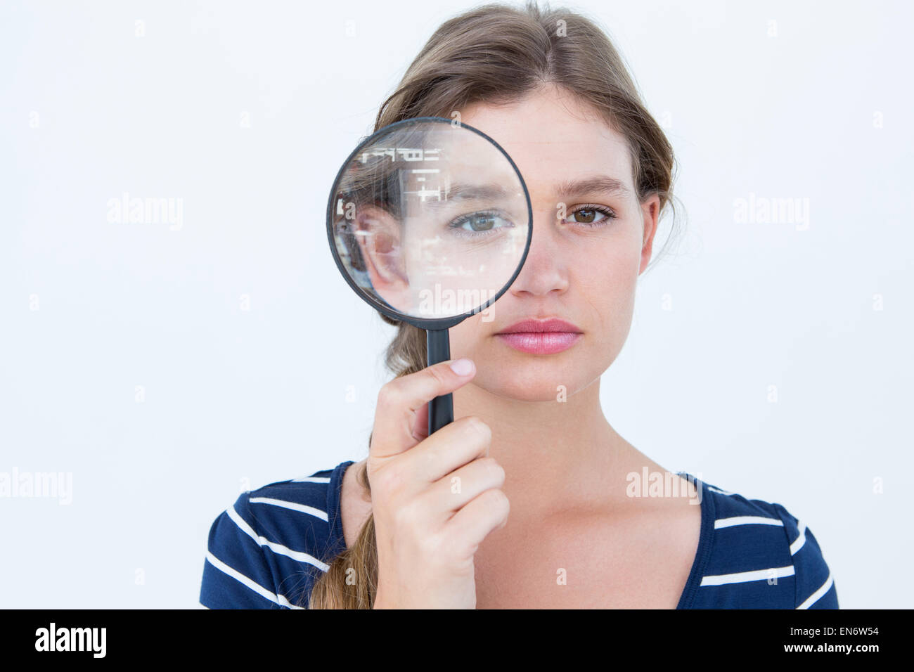Woman holding magnifying glass Stock Photo - Alamy