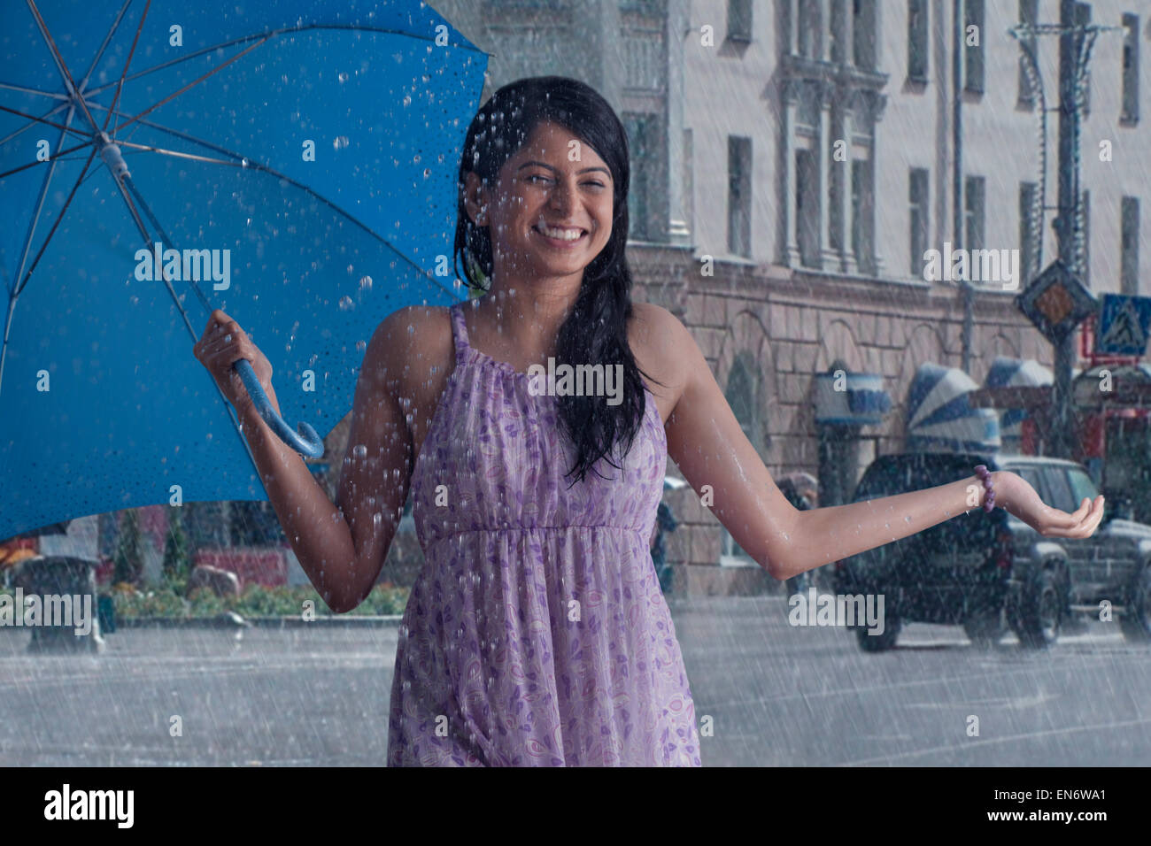 Woman having fun in the rain Stock Photo - Alamy