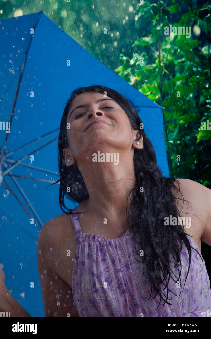 Woman having fun in the rain Stock Photo - Alamy