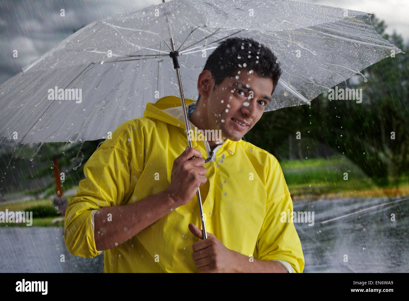 Man with umbrella in rain Stock Photo - Alamy