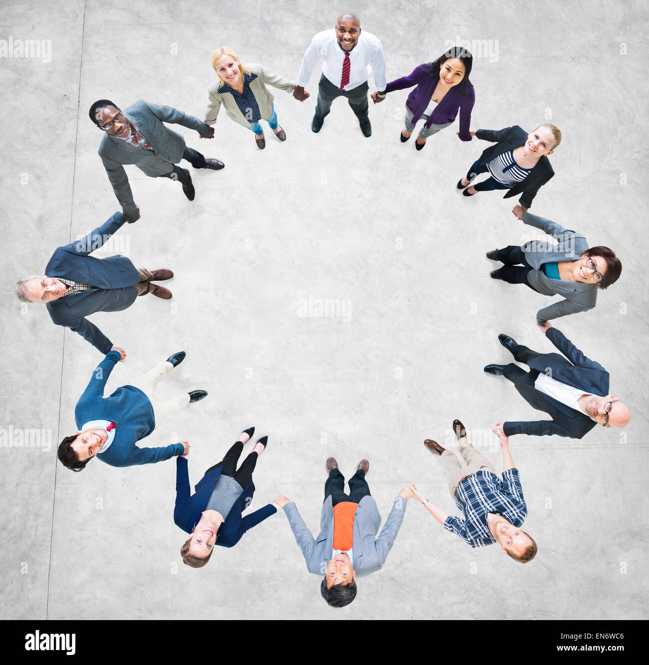 Cheerful Business People Holding Hands Forming a Circle Stock Photo - Alamy