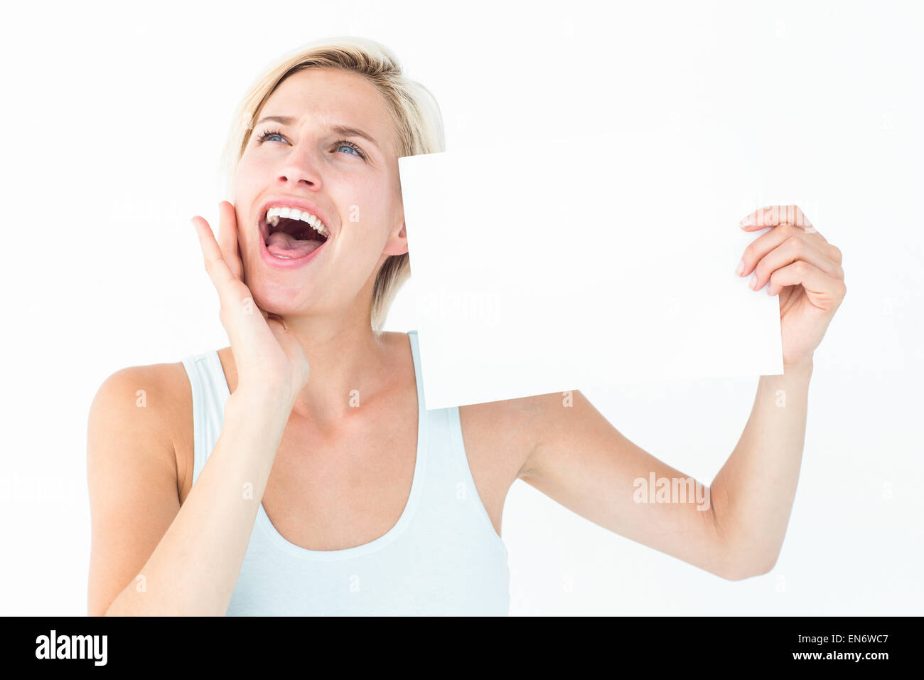 Happy blonde with poster screaming Stock Photo - Alamy