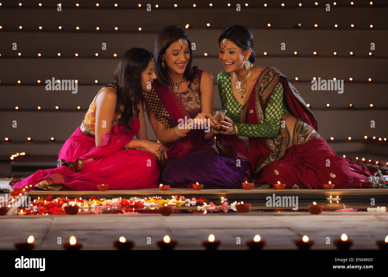 Friends looking at a picture Stock Photo - Alamy